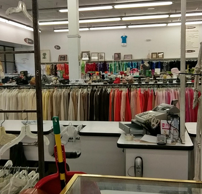 From this cashier's perspective, you can see the rainbow of color-coded clothing sections that make Value World's organization system surprisingly effective.