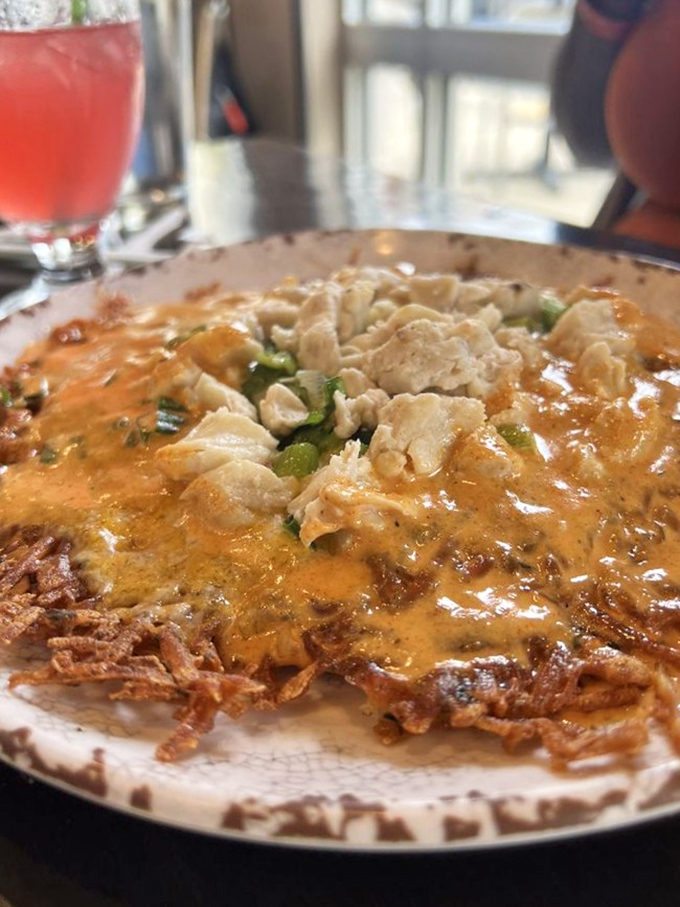 This crab hash is what breakfast dreams are made of&mdash;crispy potatoes, tender crab, and green onions swimming in a sauce worth bottling and selling.