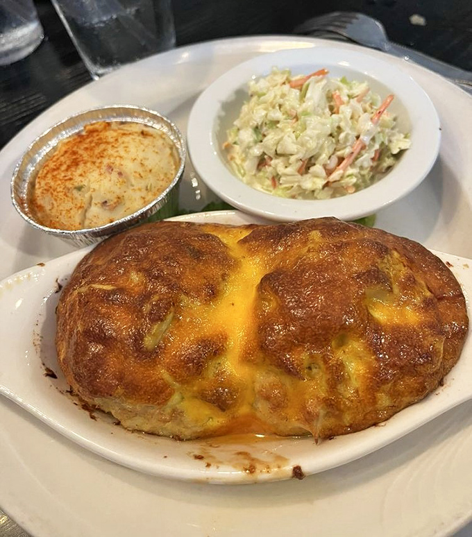 Two golden domes of crab imperial that prove sometimes the best things come in perfectly portioned pairs.