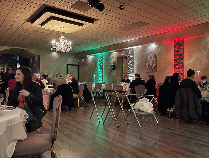 The dining room transforms for special occasions with colorful lighting that adds festive energy without sacrificing the warm atmosphere.