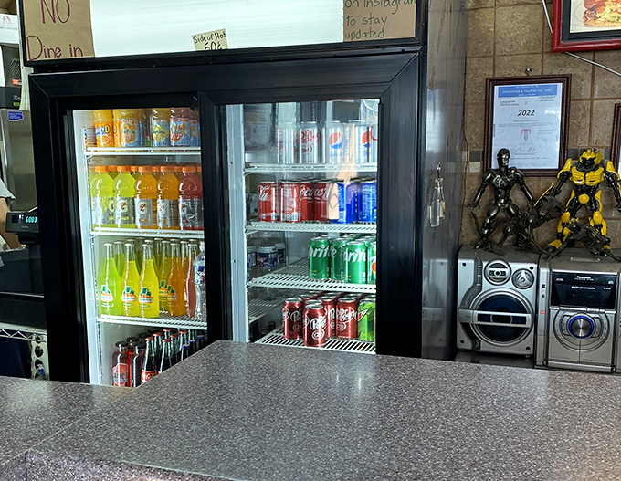 Old-school beverage selection behind glass doors&mdash;because sometimes you need a cold soda to cut through all that delicious fried goodness.