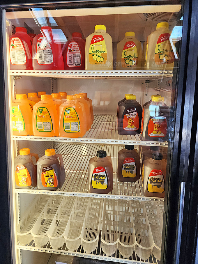 A refrigerator stocked with Turner's tea and lemonade—the unofficial beverage of Pittsburgh. Like finding an oasis in a smoky desert, these sweet sips cool the fire.