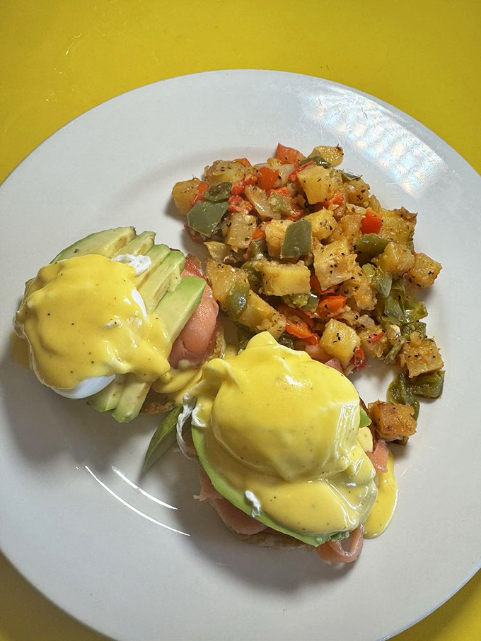 Eggs Benedict: where hollandaise sauce flows like liquid gold over Canadian bacon and poached eggs that burst with sunrise-colored yolks.