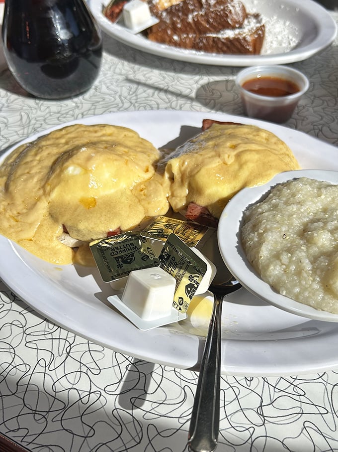 Eggs Benedict: where hollandaise sauce flows like liquid sunshine over English muffins. Grits on the side because, well, North Carolina.