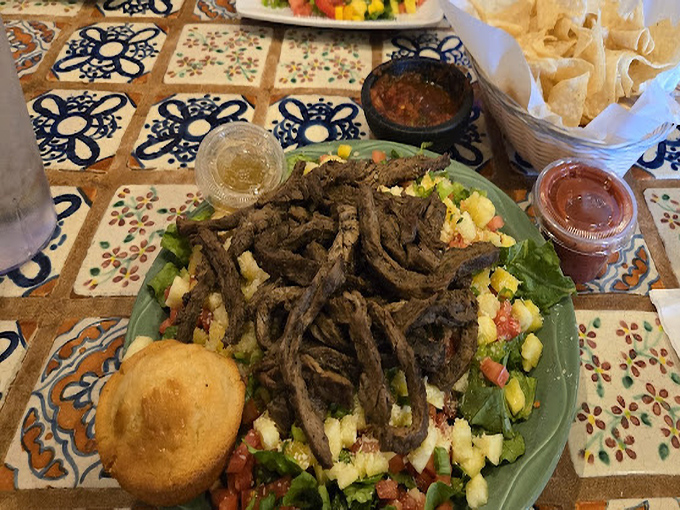 When a steak fajita salad looks this good, even dedicated carnivores won't mind the presence of vegetables. Note the perfect char on that beef!