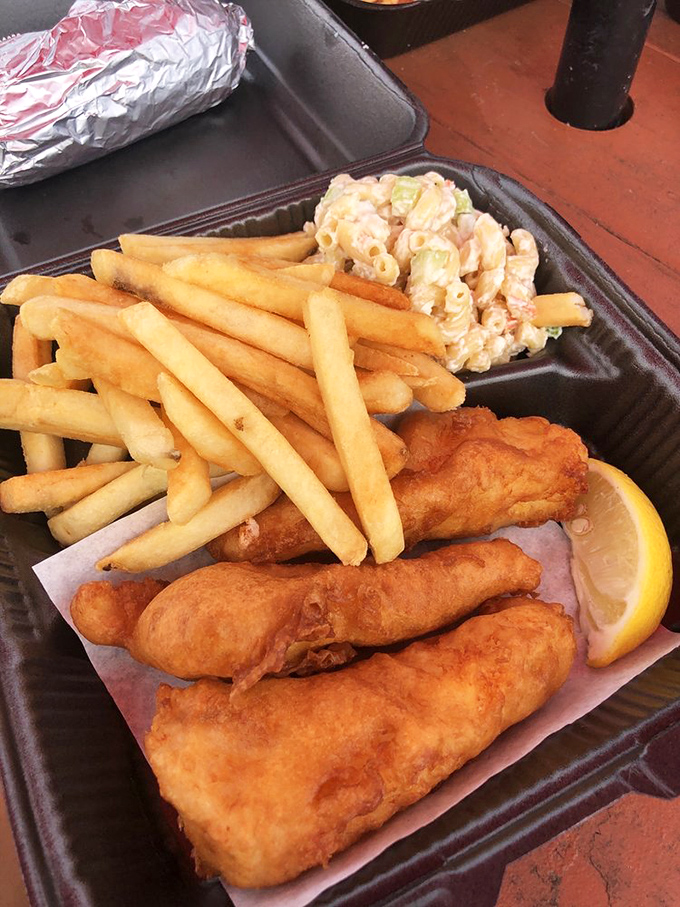 Fish and chips that would make a British pub jealous, with a side of mac salad that whispers "you're in California now."