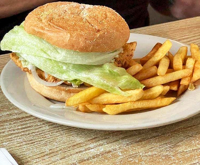 A fish sandwich that doesn't need to name-drop its pedigree &ndash; the proof is in that perfectly golden fillet peeking out beneath fresh lettuce.