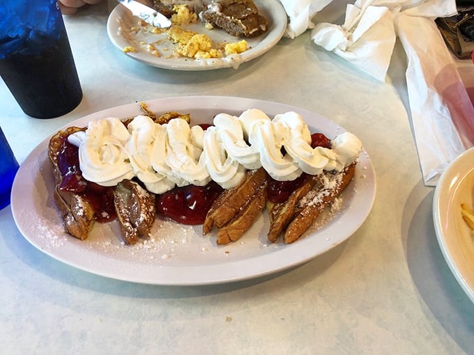 French toast that's dressed for success with a parade of whipped cream, cherry topping, and powdered sugar. Breakfast or dessert? Why not both?