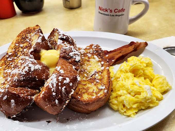 French toast that's achieved the golden-brown perfection we all attempt at home but rarely achieve, dusted with powdered sugar like fresh snow.