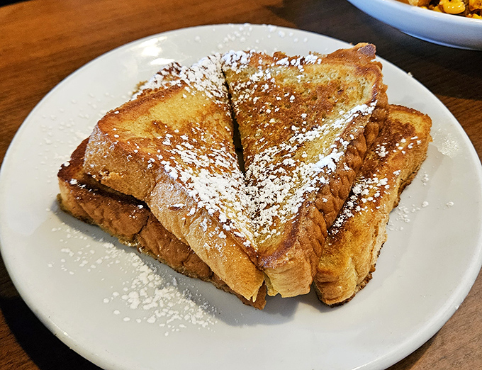 French toast that's been promoted to French royalty—golden, powdered with sugar, and worthy of its own national holiday.