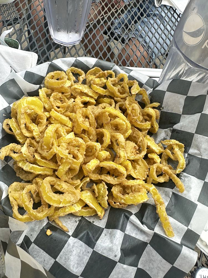 Truth in advertising: a perfect pint alongside perfectly golden fried delights. The beer's cold, the food's hot, and all's right with the world.