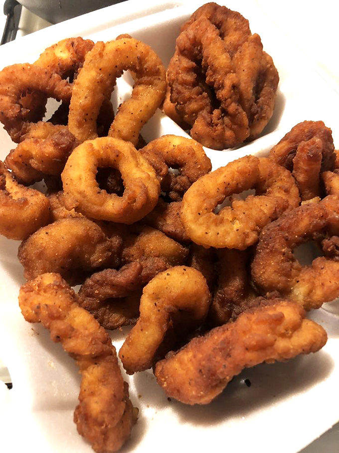 These golden calamari rings aren't just fried&mdash;they're transformed into crispy, tender treasures that disappear faster than your New Year's resolutions.