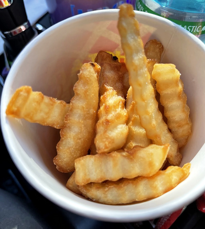 These aren't just fries; they're golden happiness sticks that crackle with each bite and make ketchup feel like it won the lottery.