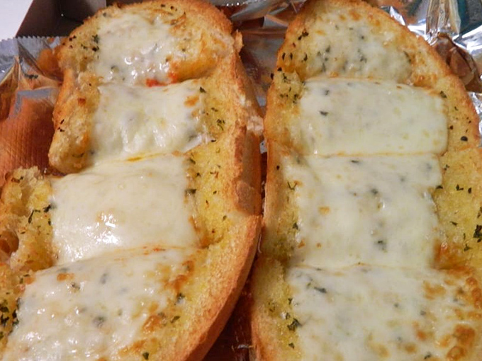 Garlic bread that could make a vampire reconsider its life choices. The cheese pull alone is worth the trip.