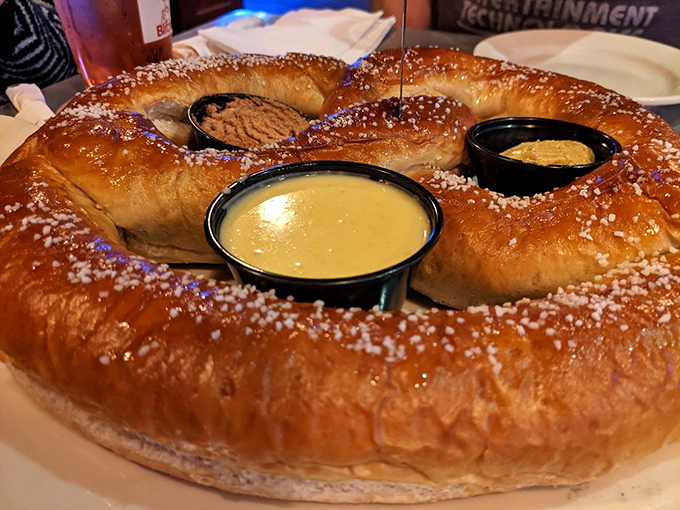 This isn't just a pretzel&mdash;it's carb architecture. A golden-brown behemoth with dipping sauces that demands to be shared (but you won't want to).