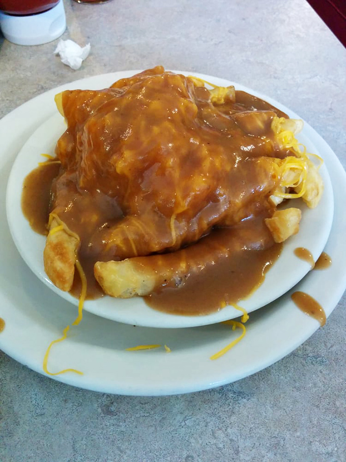 Behold the famous gravy cheese fries – a glorious avalanche of brown gravy and melted cheddar that makes French fries reach their highest potential.
