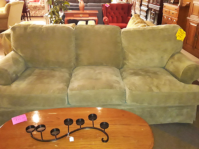 A mint-green sofa with enough cushioning to survive even the most dramatic flop after a long day. Paired with a candelabra for instant sophistication.