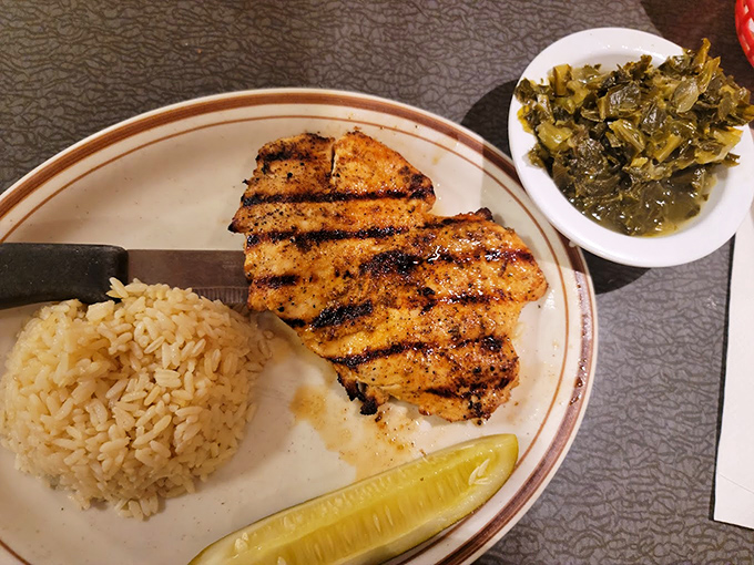 Who says diners only excel at breakfast? This perfectly grilled chicken with rice and collard greens proves they know their way around dinner too.