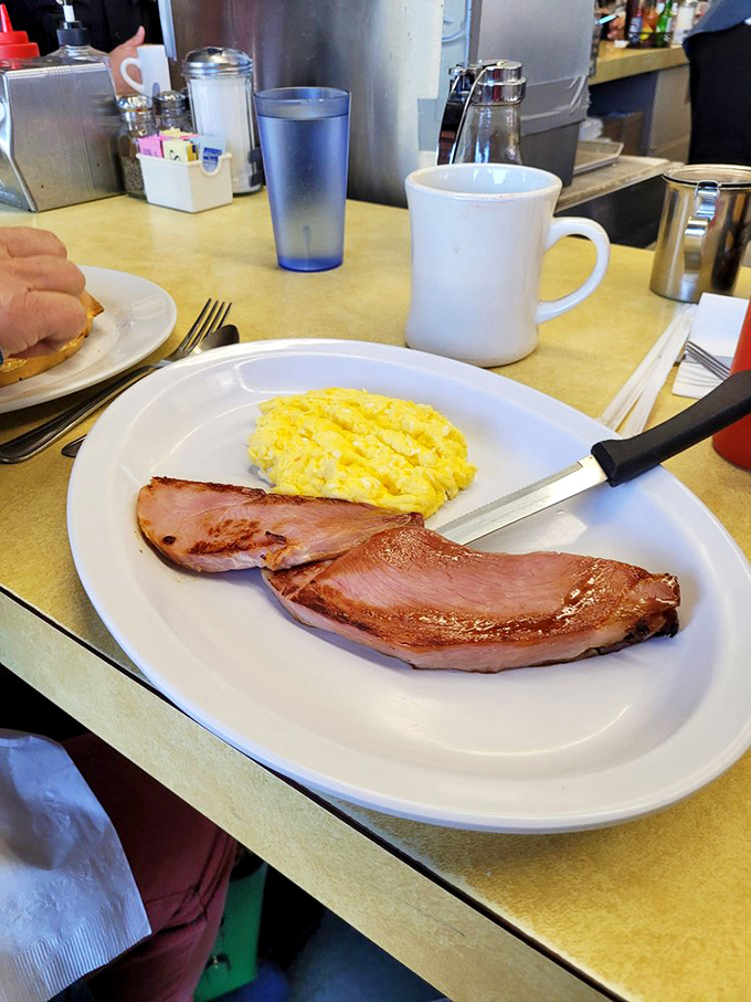 Sometimes simplicity is the ultimate sophistication. Perfectly scrambled eggs alongside ham that's been kissed by the grill&mdash;breakfast doesn't need to be complicated to be extraordinary.