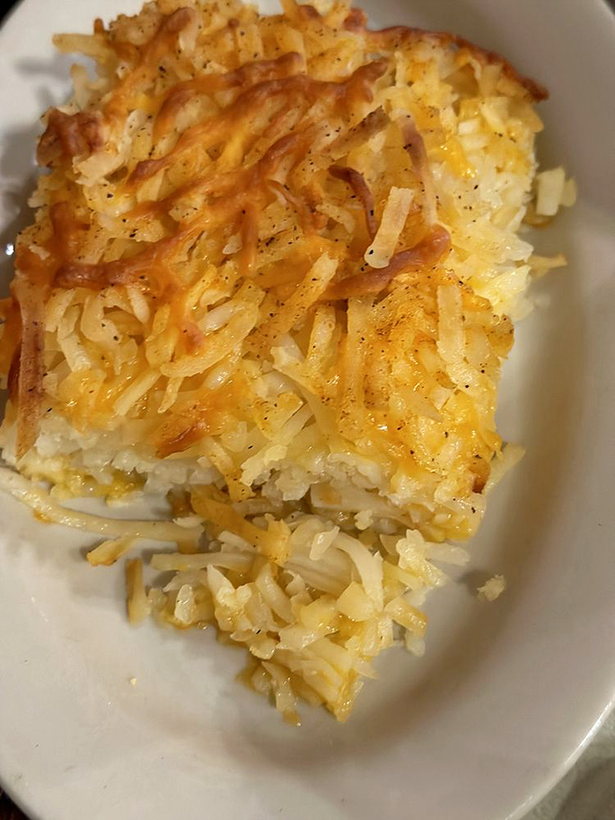 Sausage links and a perfect omelet topped with microgreens - proof that simple breakfast classics can still surprise when made with care.