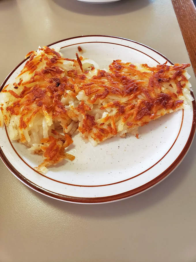 Hash browns with the perfect crisp-to-tender ratio. The golden-brown exterior shatters with each bite, revealing potato perfection beneath.