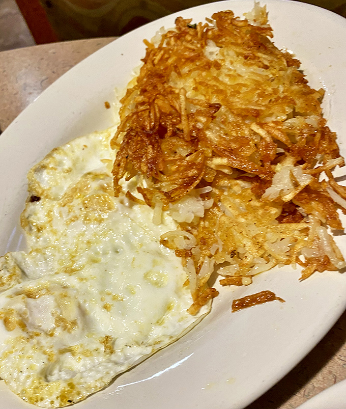 These eggs and hash browns have achieved the impossible breakfast dream: crispy edges, fluffy centers, and zero guilt about either.