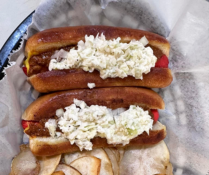 Hot dogs dressed to impress with coleslaw piled high. In North Carolina, a naked hot dog is practically considered indecent exposure.