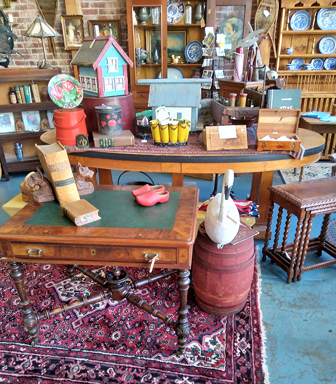 A miniature village worth of vintage decor sits atop antique furniture, like a museum diorama of Americana you can actually take home.