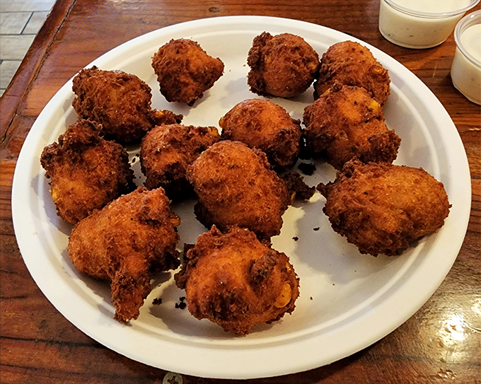 Hush puppies that don't know how to whisper. These golden-brown spheres of cornmeal joy practically shout their deliciousness across the table.