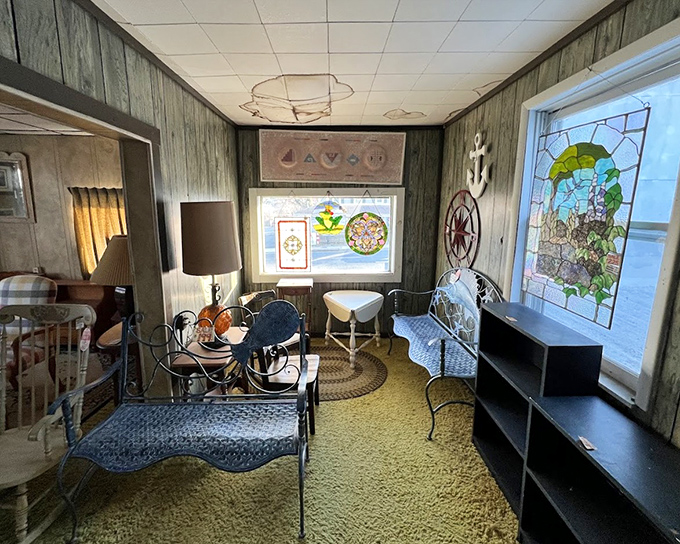 Iron furniture and stained glass create a maritime meditation space. The perfect spot to contemplate life's big questions&mdash;like whether you need that compass rose.