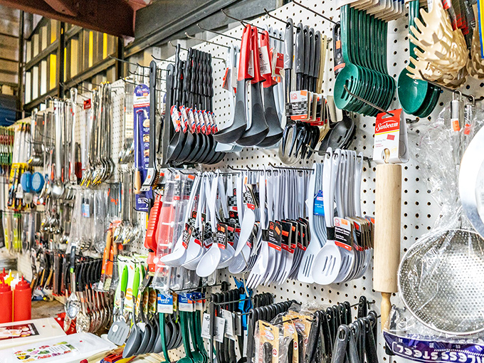 Kitchen gadget nirvana! Every utensil imaginable hangs in perfect order, promising to solve cooking problems you didn't know you had. 