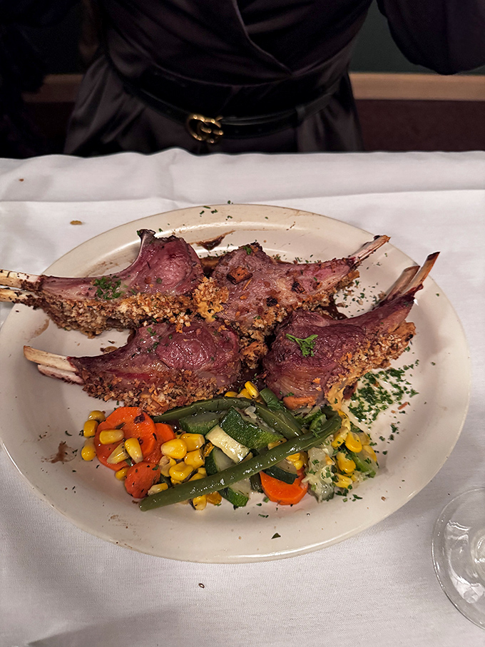 Rack of lamb with a golden crust that snaps like autumn leaves. The vegetable medley isn't just a sidekick&mdash;it's Robin to this meaty Batman.