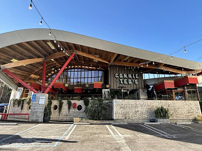 The curved roofline and string lights create a welcoming beacon for seafood pilgrims. Like a modern lighthouse guiding you to delicious waters.