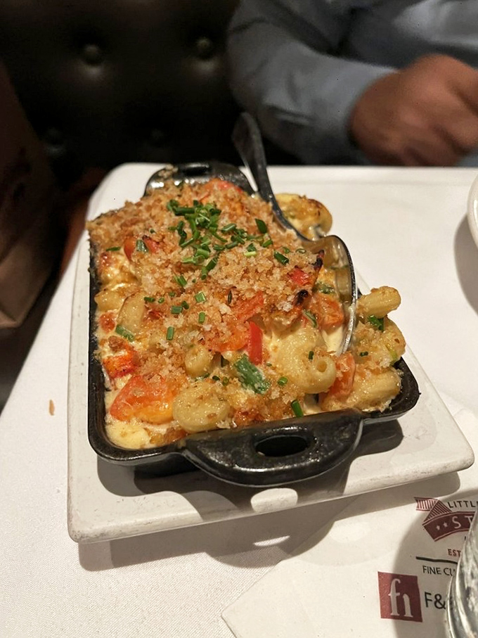Mac and cheese for grown-ups. This lobster-studded, crispy-topped indulgence is what childhood dreams become when they mature into adult cravings.