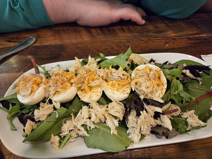 These aren't your standard deviled eggs—they're Maryland-meets-Munich masterpieces topped with delicate crab. Tiny flavor bombs of cross-cultural brilliance.