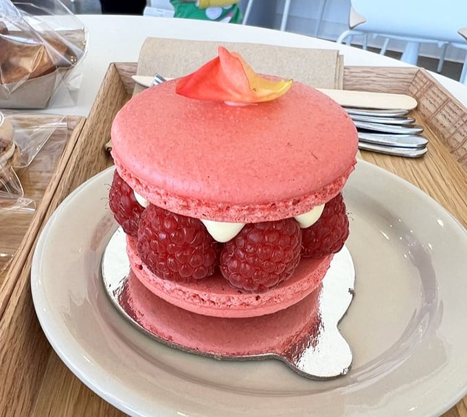 The raspberry macaron cake&mdash;where "too pretty to eat" meets "too delicious not to." Those fresh berries are nature's little rubies.