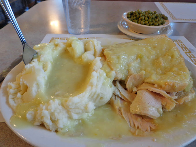 Turkey and mashed potatoes swimming in gravy lake. Comfort food that hugs you from the inside out.