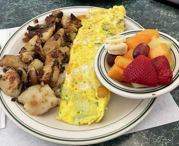 An omelet that puts most restaurant offerings to shame, paired with home fries and fresh fruit. The breakfast trifecta that makes mornings worth facing.