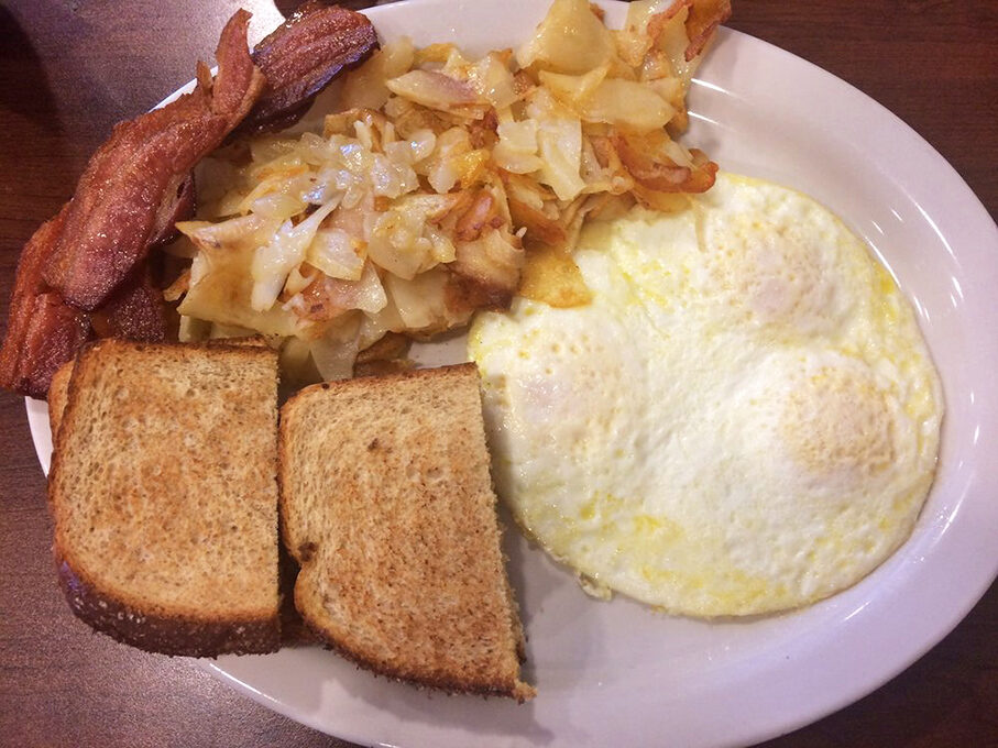 The classic breakfast trinity: perfectly cooked eggs, crispy hash browns, and toast. Simple food executed with the respect it deserves.