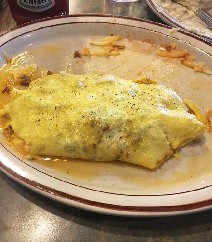 This omelet could double as a pillow - if pillows were filled with cheese and pure breakfast joy.