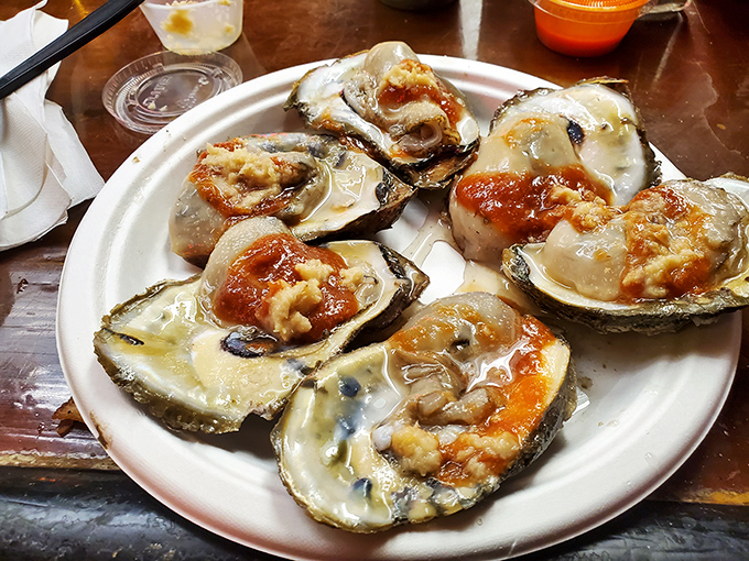 Oysters on the half shell, glistening like jewels. Nature's perfect appetizer comes with a side of cocktail sauce and the satisfaction of knowing you're eating like royalty.