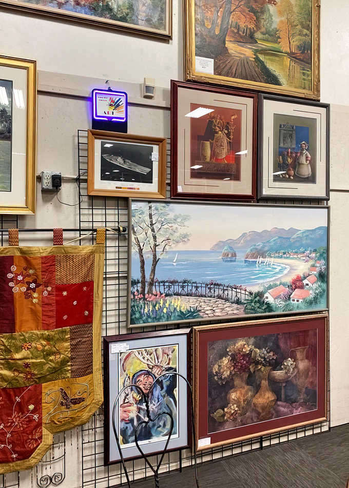 Wall-to-wall artwork transforms ordinary corridors into gallery spaces. That seaside landscape might be your ticket to daily mental vacations.