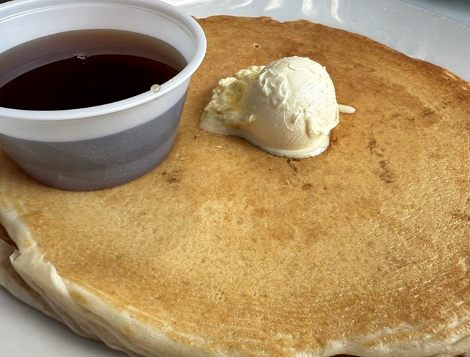 Pancakes should always wear a hat of melting butter and come with a side of maple syrup deep enough to skinny dip your fork in.
