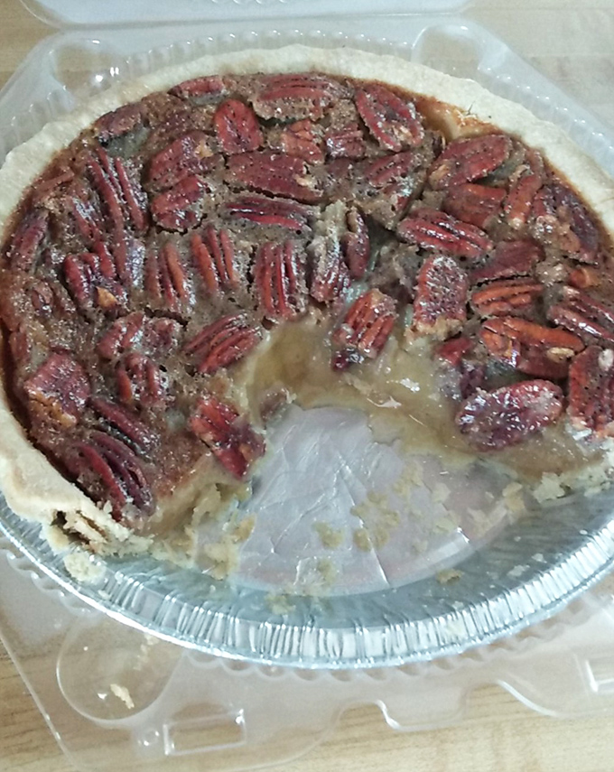 Pecan pie with a bite missing because waiting to photograph it intact was simply asking too much. That gooey center is worth breaking every diet for.