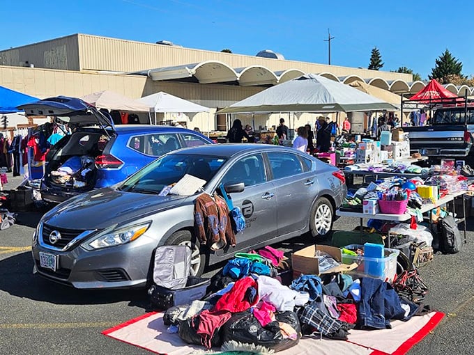 The ultimate pop-up shop: when your car becomes your storefront. Vintage clothing spills from trunks like fabric waterfalls.