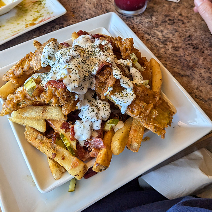 Loaded fries that laugh in the face of moderation. A glorious mess of toppings that requires both a fork and absolutely no shame.