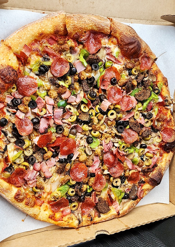 A supreme pizza masterpiece loaded with enough toppings to satisfy even your most indecisive dinner companion's wildest dreams.