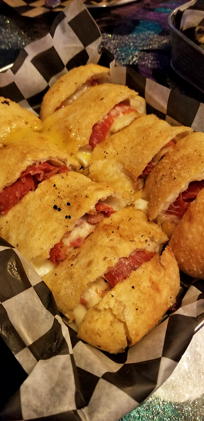 When pizza and wrap have a delicious love child. Crispy exterior giving way to melty cheese and savory fillings&mdash;handheld happiness at its finest.