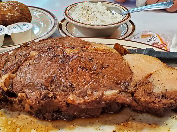 A prime rib so magnificent it deserves its own Instagram account&mdash;tender, juicy, and taking up real estate on that plate like it owns the deed.