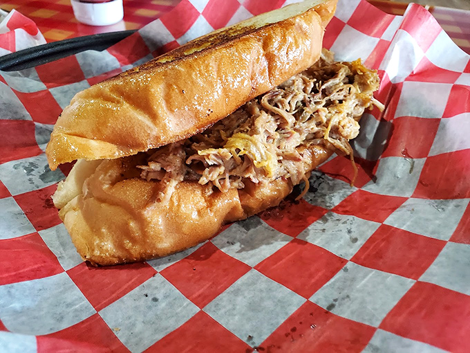 Thinly sliced brisket and onions on checkered paper—barbecue's version of fine dining. No white tablecloth needed when the meat speaks this eloquently.